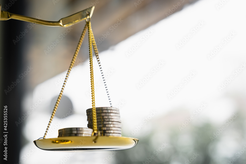 Coins stack with balance scale. Money management, financial plan, time ...