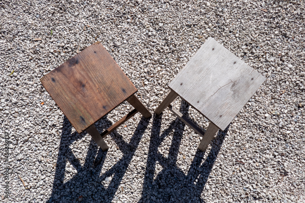 Foto de Comparison between two wooden stools. One old and ruined, the ...