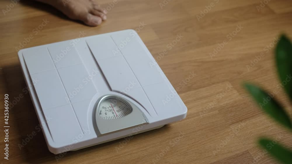 Asians foot man with body weight scales for measure weight loss ...