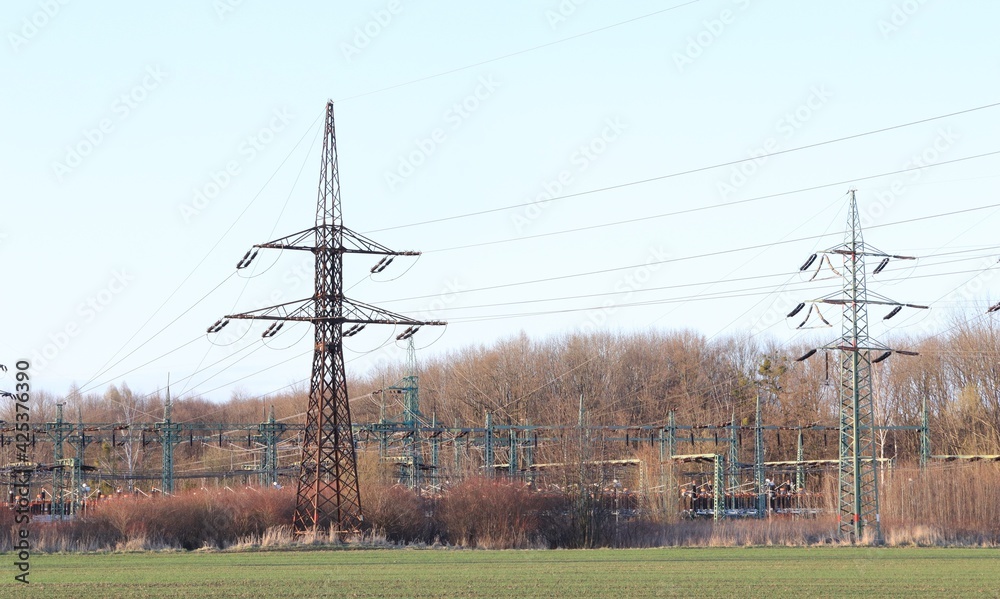 High voltage lines. Electric pylons in front of the transformer station ...