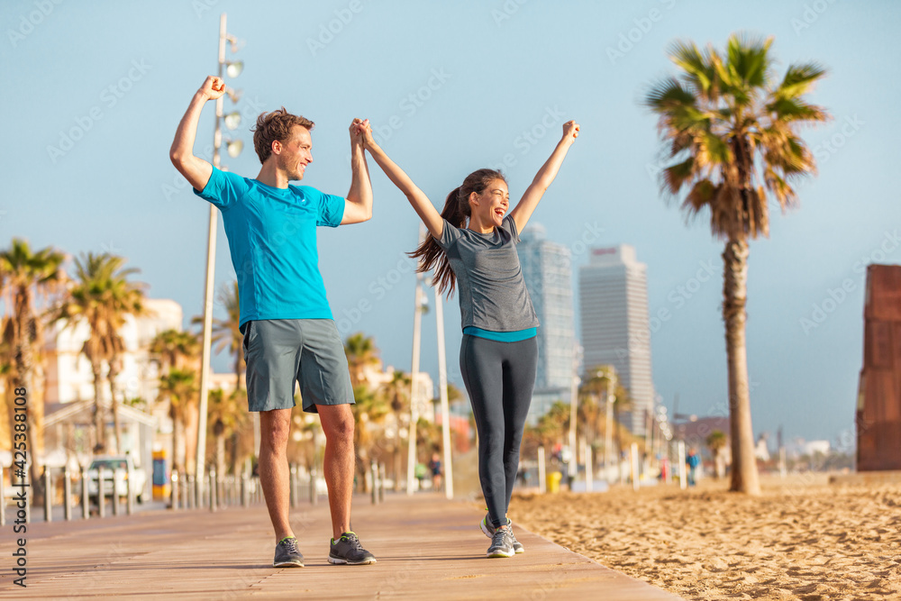 Winning couple training outdoor reaching goal happy of success in ...