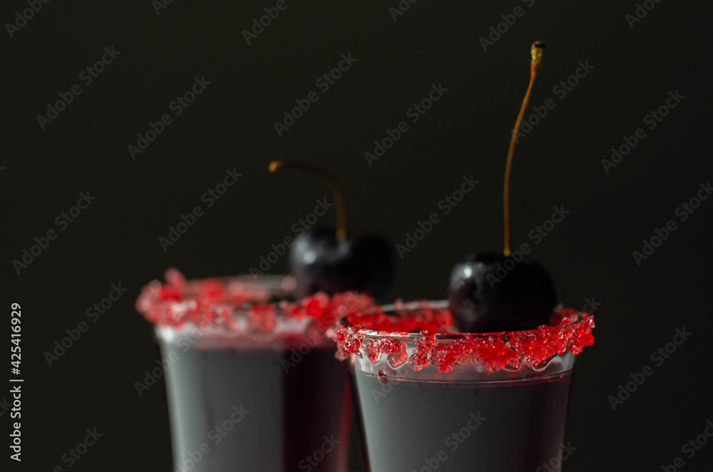 Ruby red cocktail based on vodka, cherry liqueur and syrup in drink ...