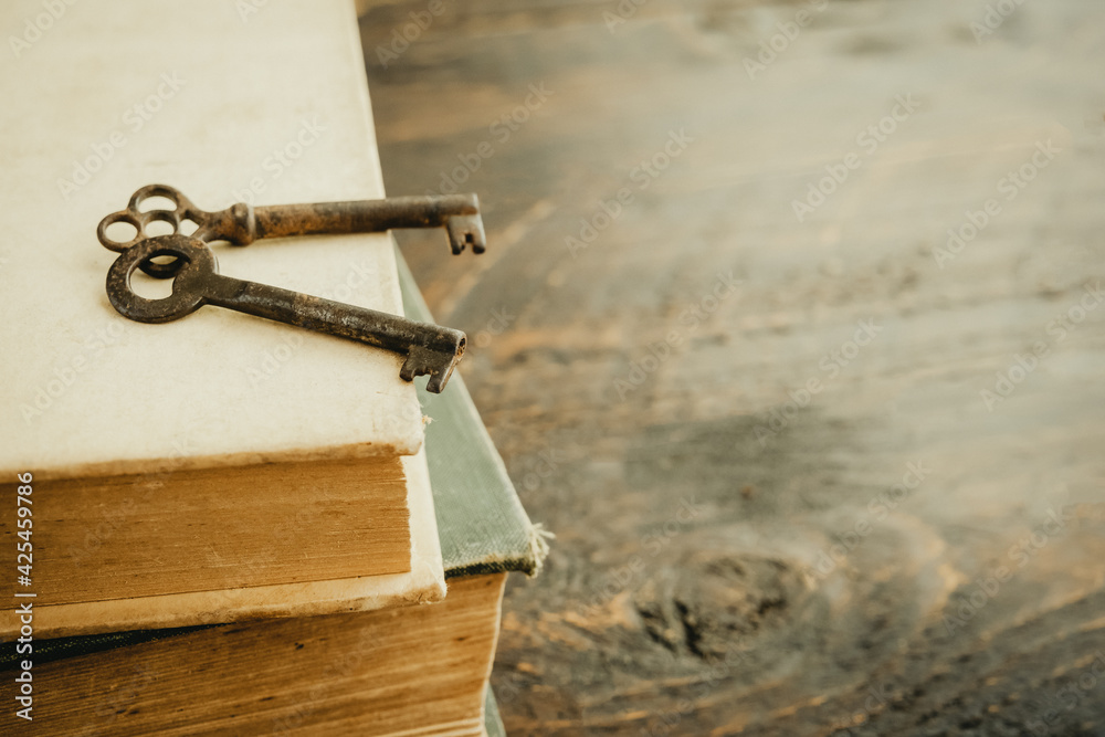 Old books and vintage keys. Books are the key to opening the doors of ...