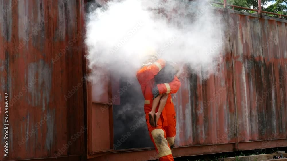 Firefighter rescue kids trapping in fire house and fighting with flame ...