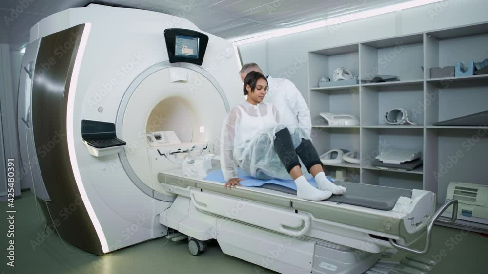 Magnetic resonance imaging in the modern hospital, adult man doctor ...