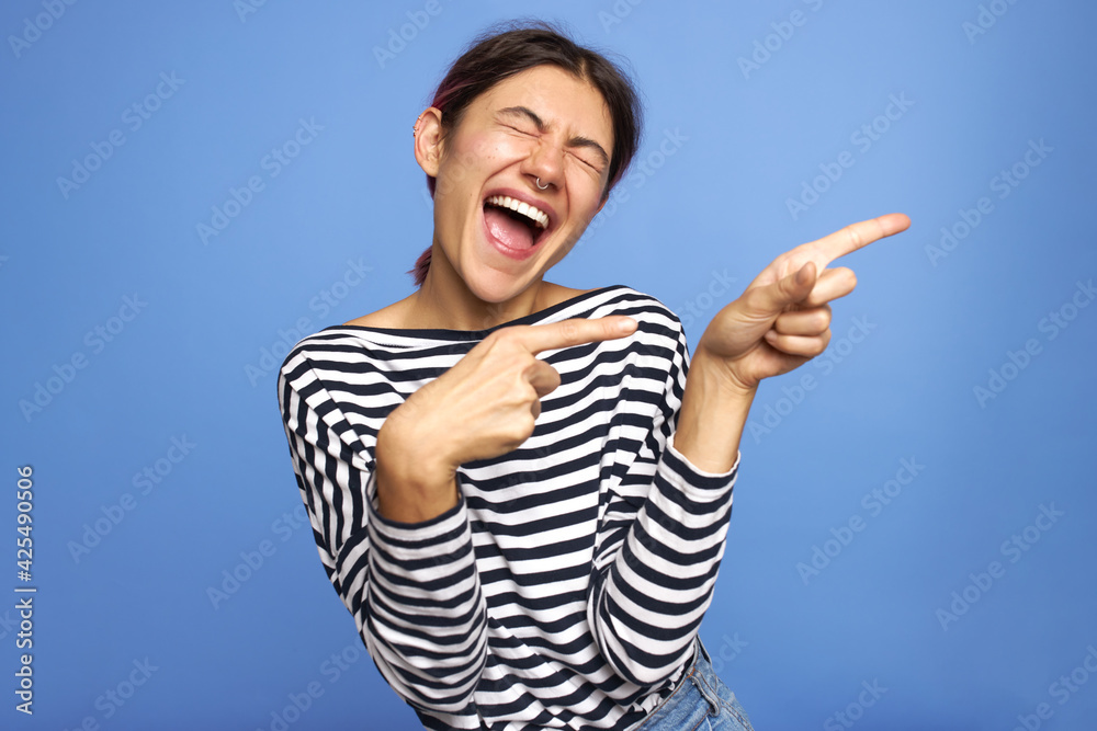 Adorable happy teenage girl with pinkish hair closing eyes and opening ...