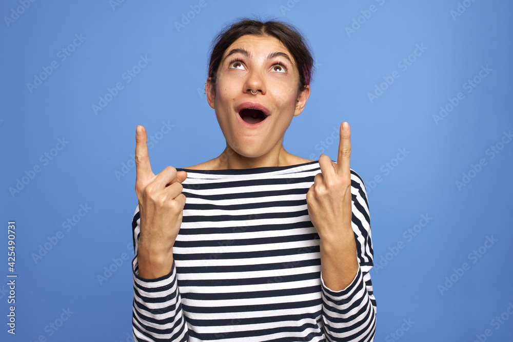 Portrait of gorgeous fascinated young European female wearing septum ...