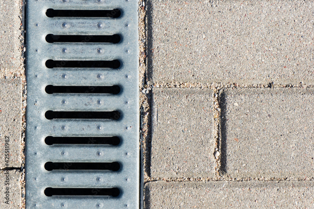 Manhole on concrete drain system cover. Urban sewer background. Metal ...