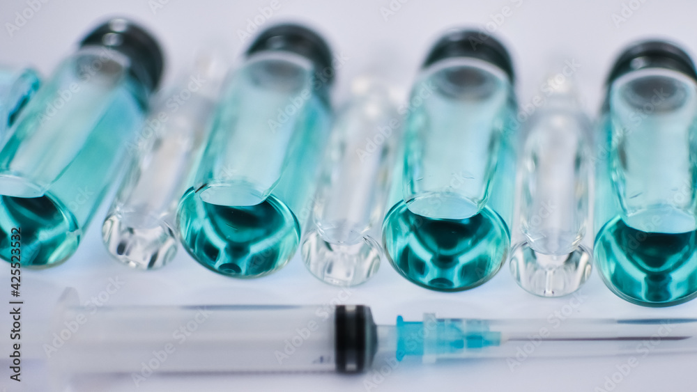 Vial vaccine, top view of glass ampoules with transparent and blue ...