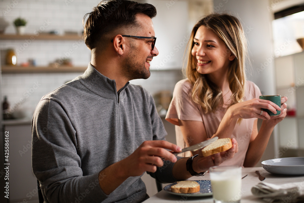 Beautiful woman enjoying in breakfast with her boyfriend. Happy young ...