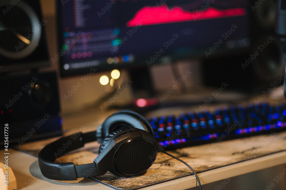 Workplace of musician at home. Table with pc, microphone and headphones ...