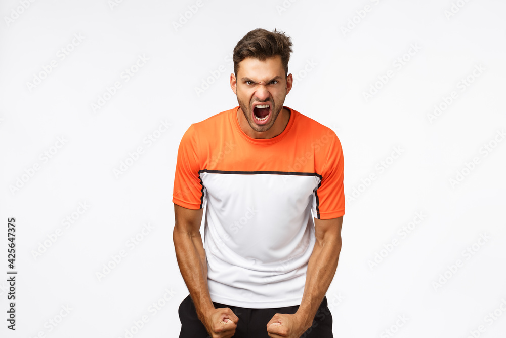 Power, strength and sport concept. Handsome aggressive and strong young ...