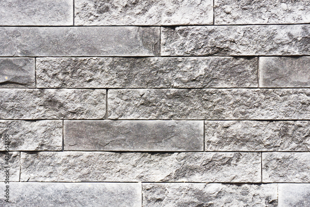 Gray house facade background. Gray brick wall texture. Decorative stone ...