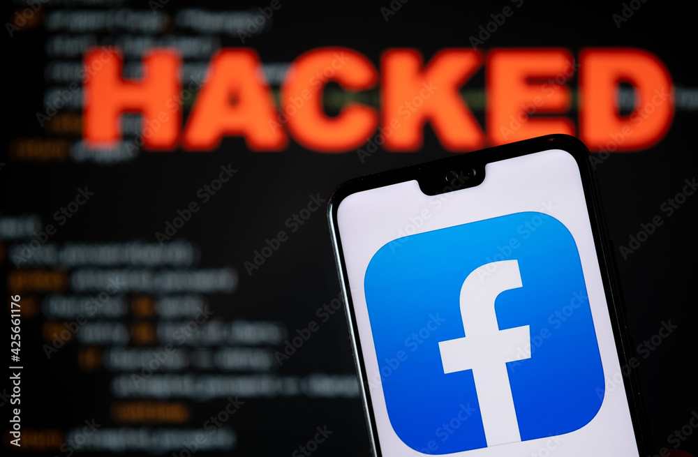Facebook app logo seen on the smartphone and blurred HACKED word with a ...