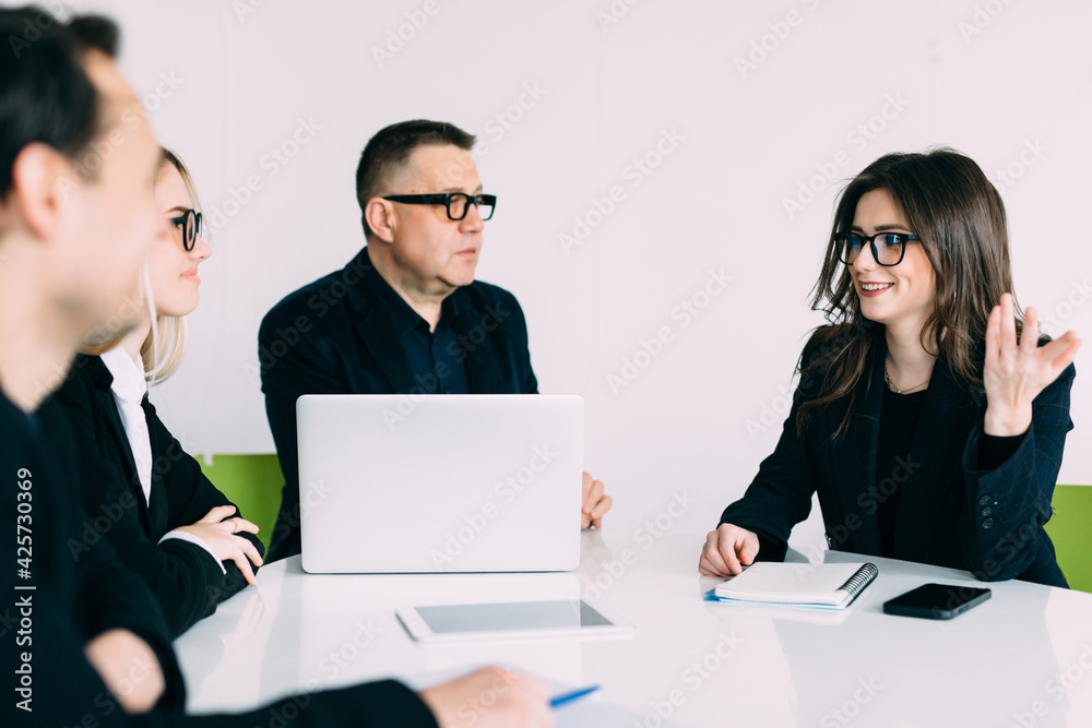 Business people showing team work while working in board room in office ...