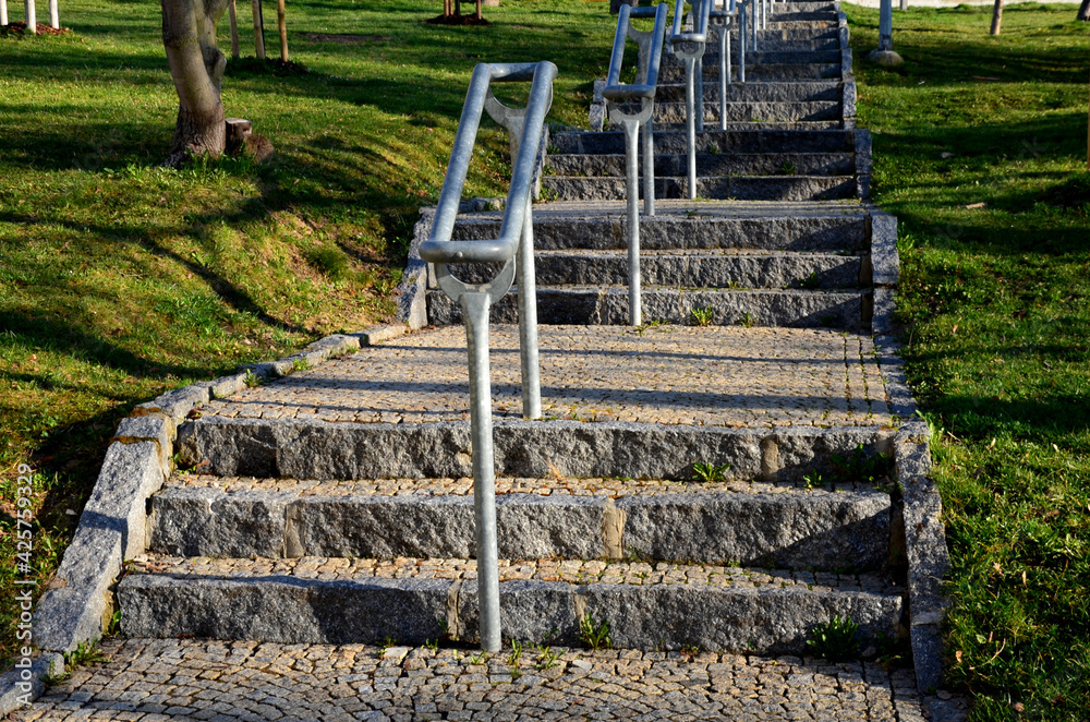 concrete long staircase with long and short pieces of stairs and ramps ...