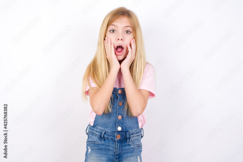 Scared terrified beautiful caucasian little girl wearing denim jeans ...