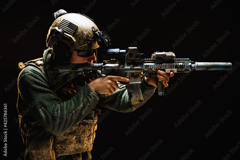 US special forces soldier looking at the aim ready to shoot against ...