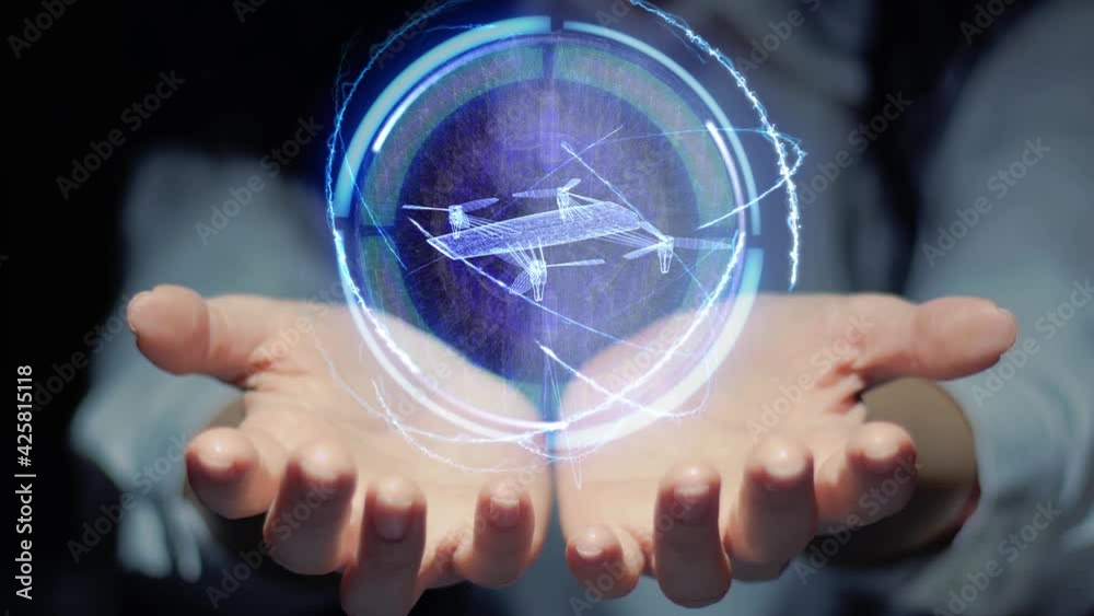 Female hands show a round conceptual hologram with drone quadcopter ...