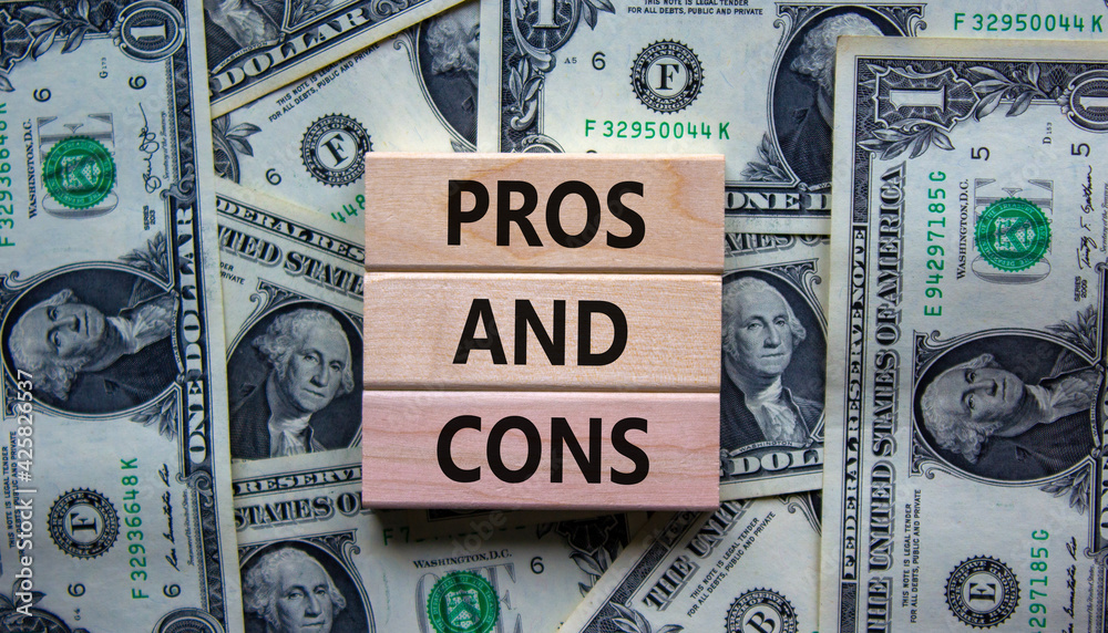 Pros and cons symbol. Wooden blocks with words 'Pros and cons ...