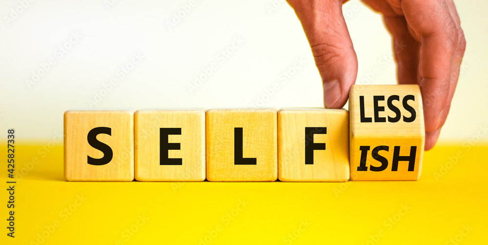 Selfish or selfless symbol. Businessman turns cubes and changes the ...