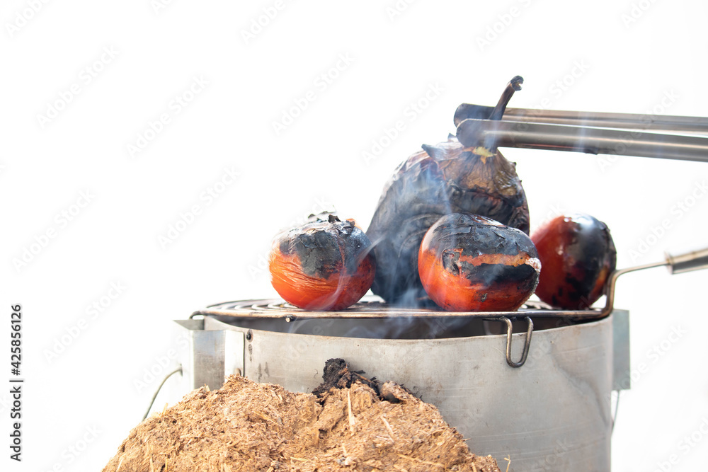 Using Tongs Chimta Pakkad Or Sandshi For Cooking Brinjal Baingan Ka ...