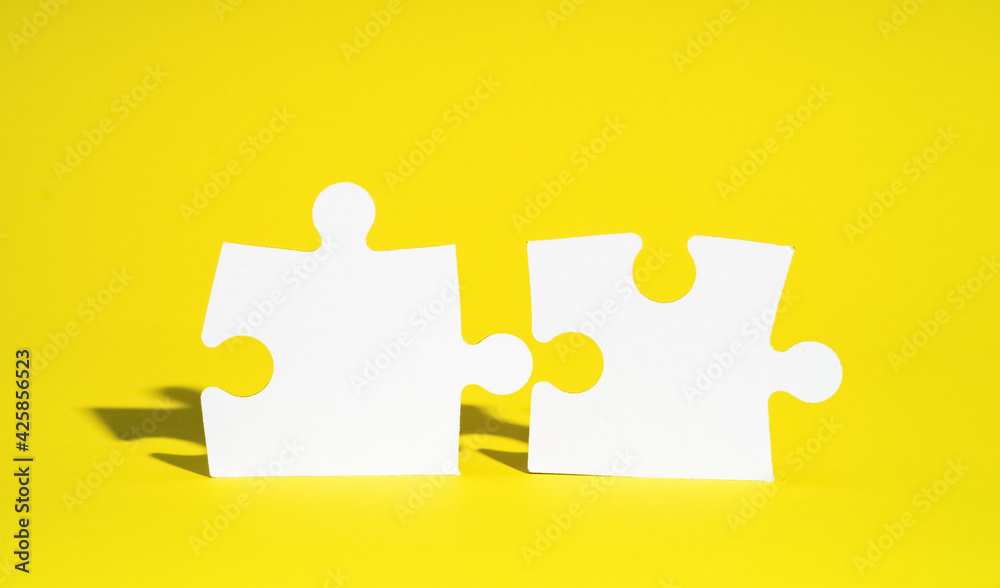 Connect couple puzzle piece on yellow background. Symbol of association ...
