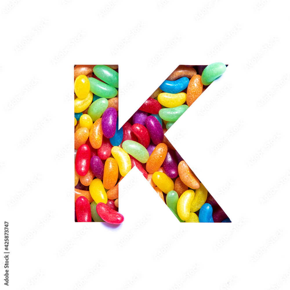 Letter K of English alphabet made of colourful rainbow glucose candies ...