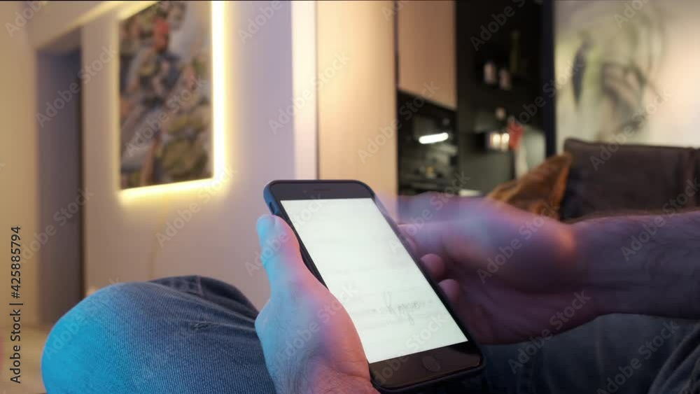 Man using smartphone scrolling through social media, doing swiping, scrolling gestures ...