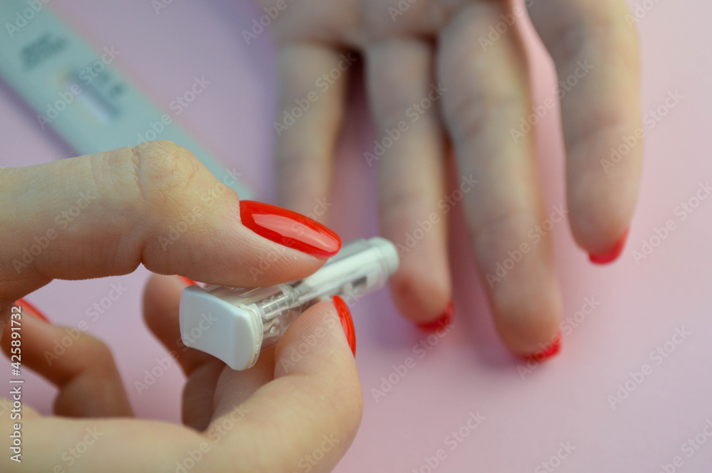 coronavirus test on a pink matte background. medical procedure. girl ...