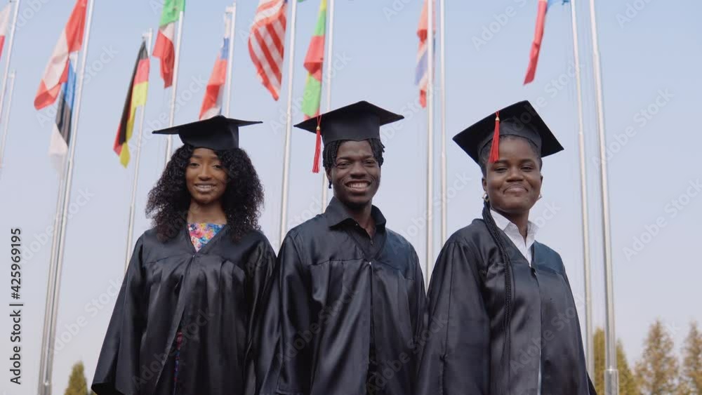 Vídeo do Stock: Three African-American university graduates stand ...