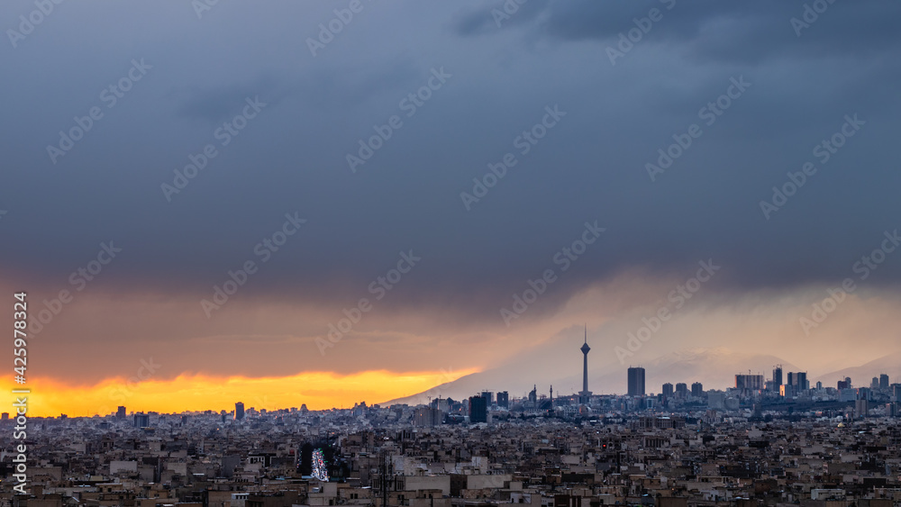 Tehran-Iran skyline at a moody sunset after a heavy storm. with Milad ...