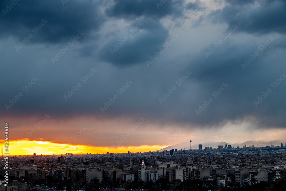 Tehran-Iran skyline at a moody sunset after a heavy storm. with Milad ...