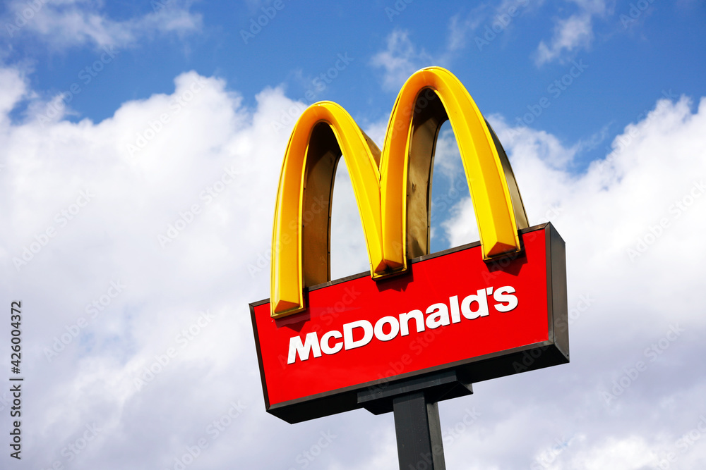 McDonalds logo on blue sky background Stock Photo | Adobe Stock