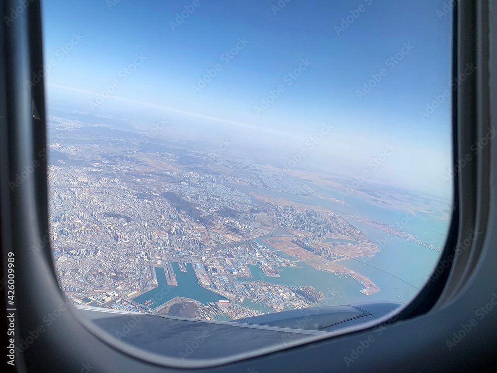Land seen through the window from an airplane on a trip Stock Photo ...