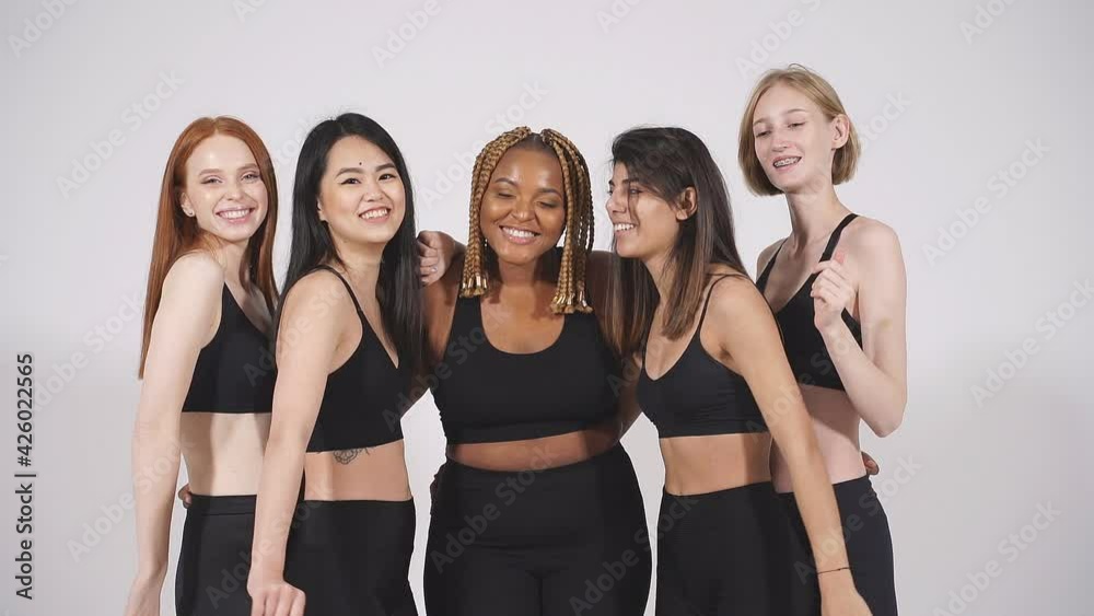 Diverse models hugging each other, having close friendship, posing at ...