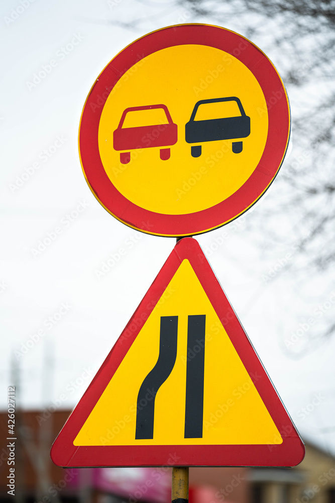 Traffic signs Attention construction site and road constriction A ...