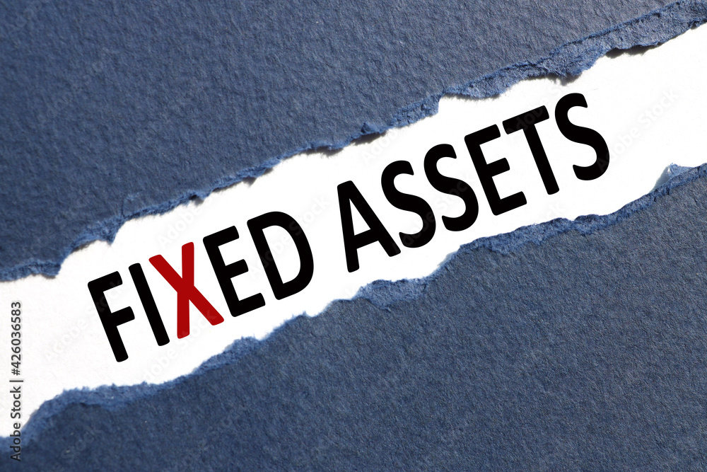 Fixed asset. text on white paper over torn paper background. Stock ...