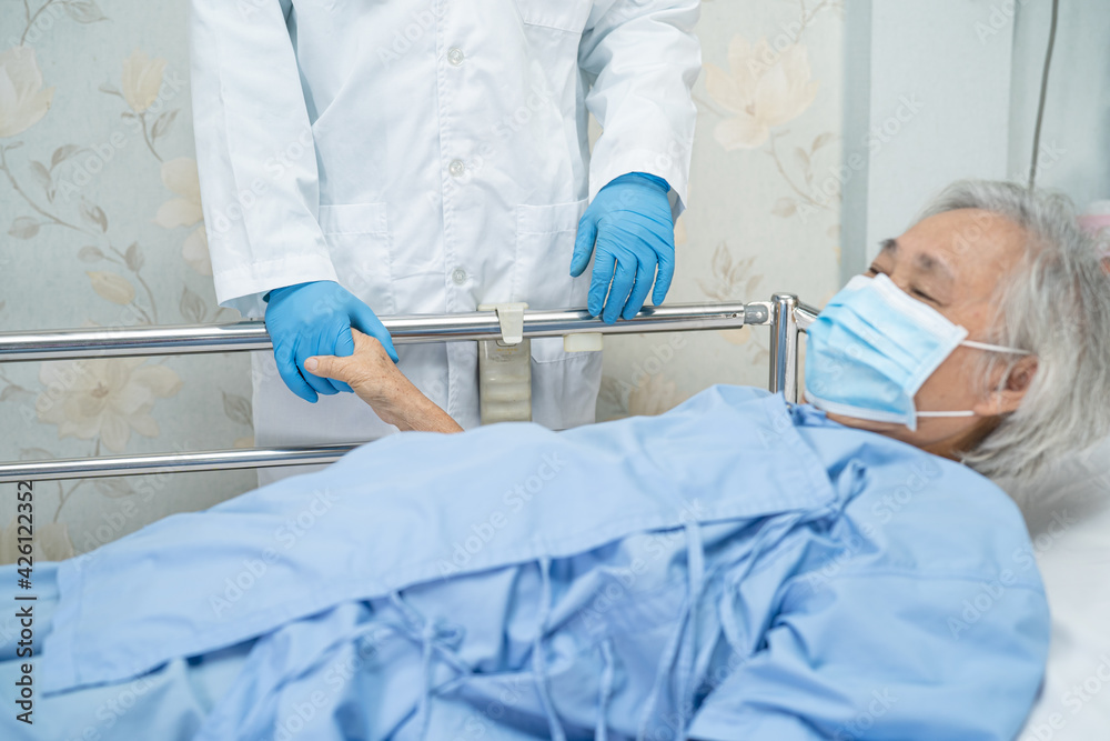 Asian doctor wearing face shield and PPE suit new normal to check ...