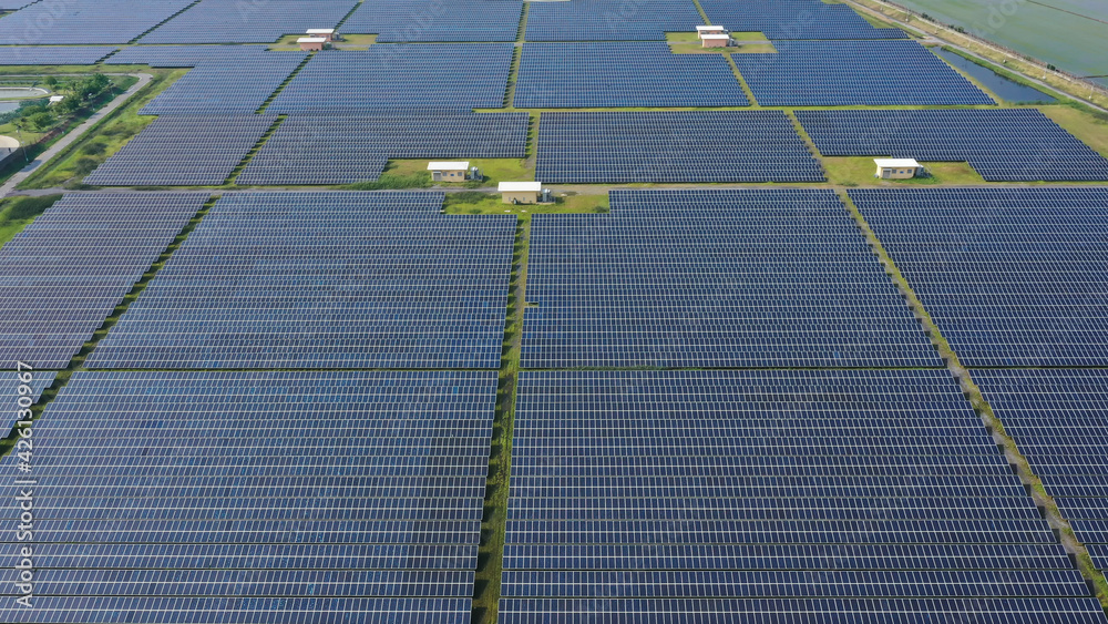 Foto de Aerial view of Solar Panels Farm (solar cell). Drone flight fly ...
