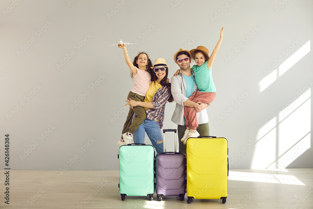 Happy family tourist portrait. Father, mother and two daughters ready ...