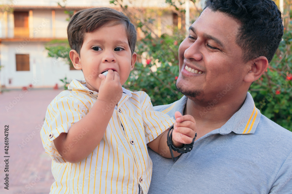 Hispanic father and son spend a day together in the park Stock Photo ...