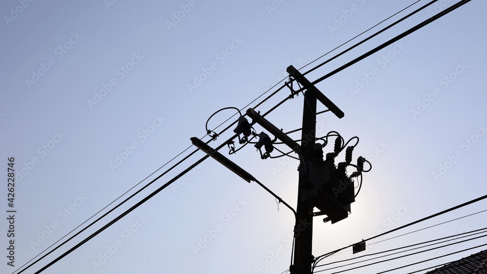 Silhouette of a transformer on a pole. Three-phase distribution ...