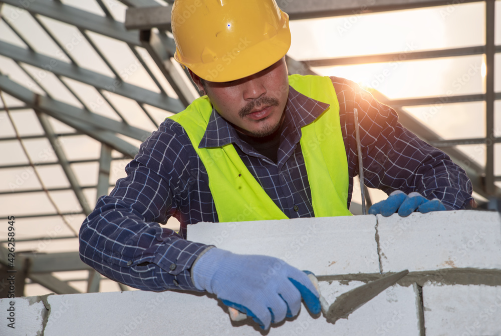 Zdjęcie Stock: Professional construction workers wear safety helmets ...