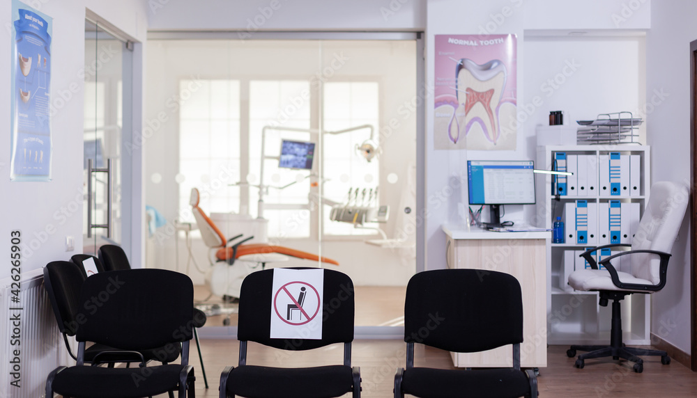 Waiting room in clinic with nobody in it, front office with new normal ...