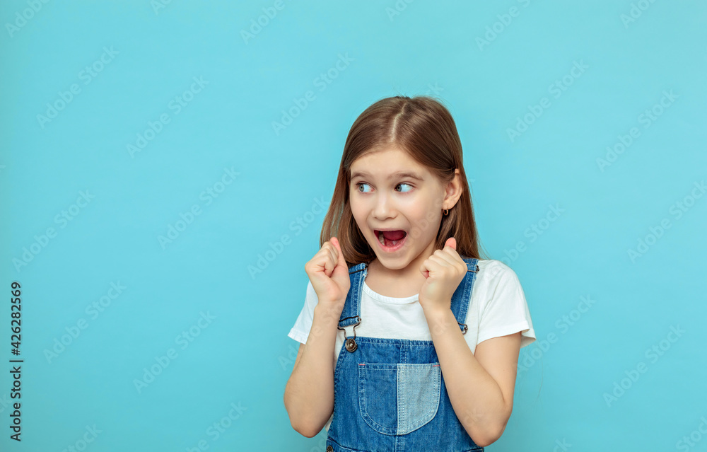 Beautiful little girl is surprised. Expressive facial expressions are ...