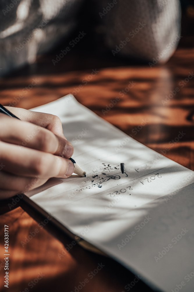 Pencil Writing Words On Paper