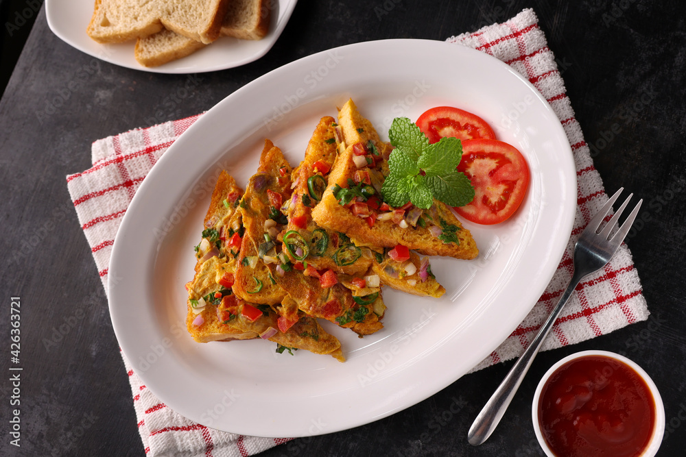 Bread omelet Indian street food with tomato sauce breakfast food non ...