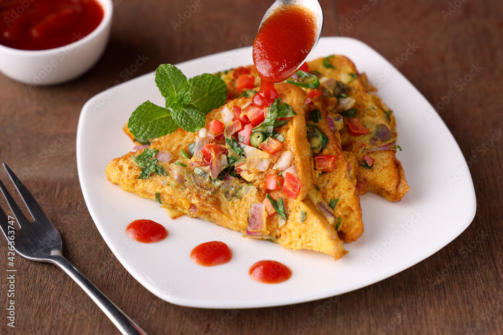 Bread omelet Indian street food with tomato sauce breakfast food non ...