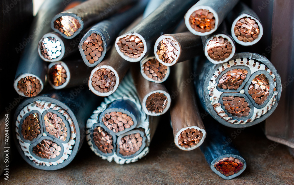 Macro photo of many copper wires twisted into rods and covered with ...
